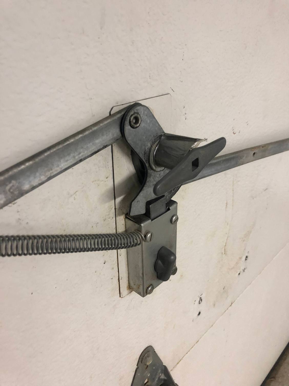 Is there a way to tighten garage door lock bar handle - DoItYourself ...
