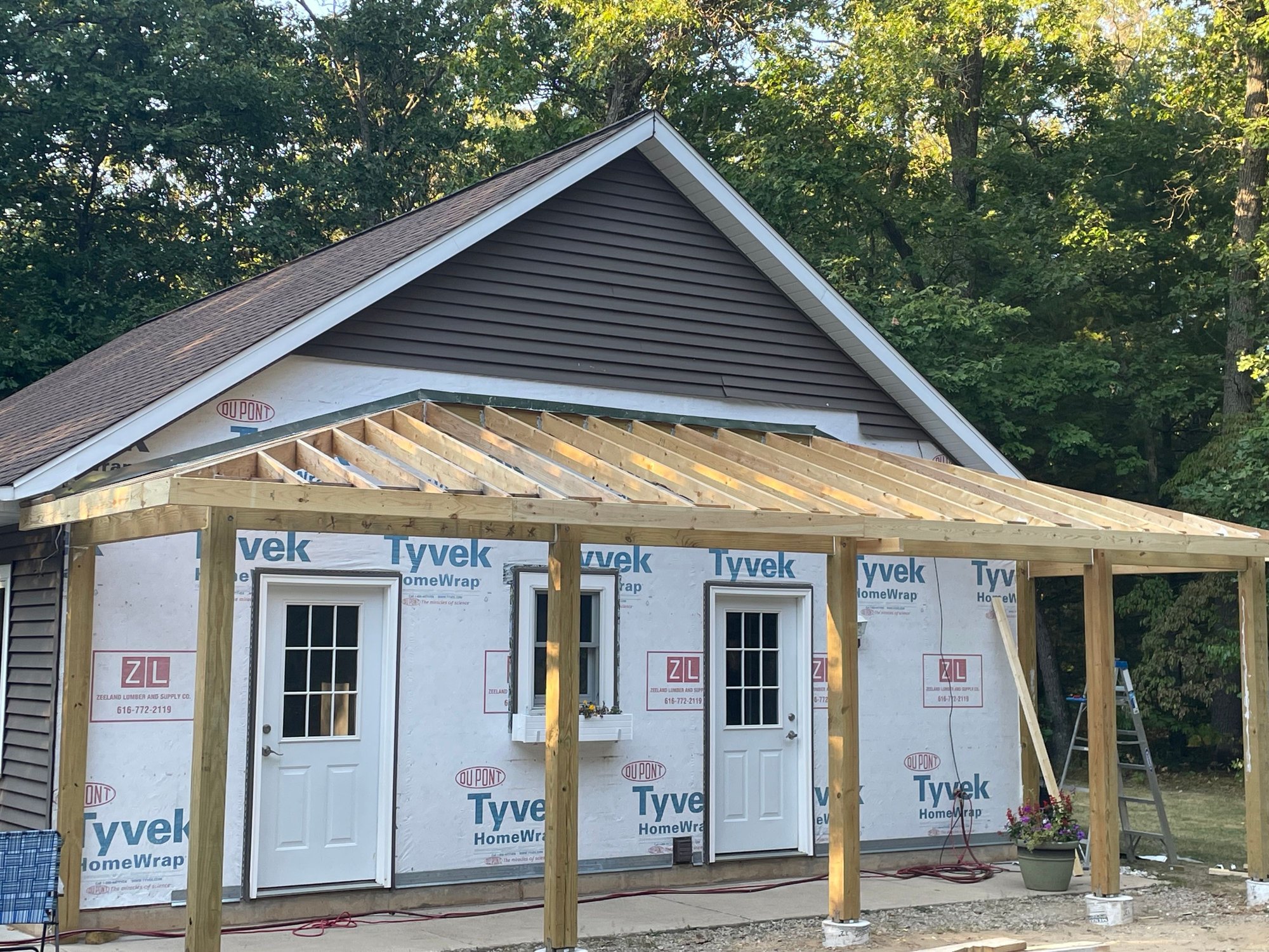 Fitting new porch roof under existing house eaves - DoItYourself.com ...