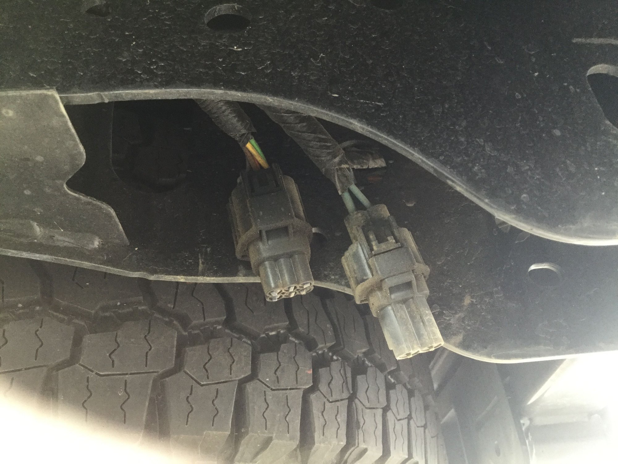 What are the plugs under the truck just below the drivers tail light ...